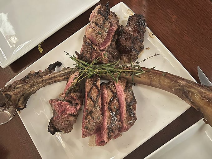 Behold the magnificent Tomahawk steak—a Fred Flintstone-worthy cut that's been expertly prepared to showcase both primal appeal and culinary finesse.
