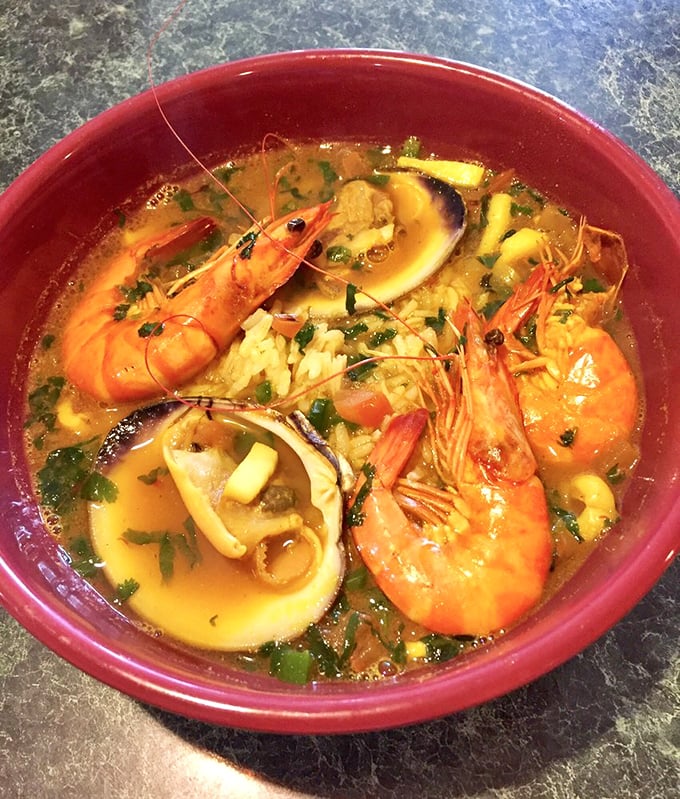 Golden broth swimming with prawns and tender squid—this tumbada soup could cure what ails you and then some.