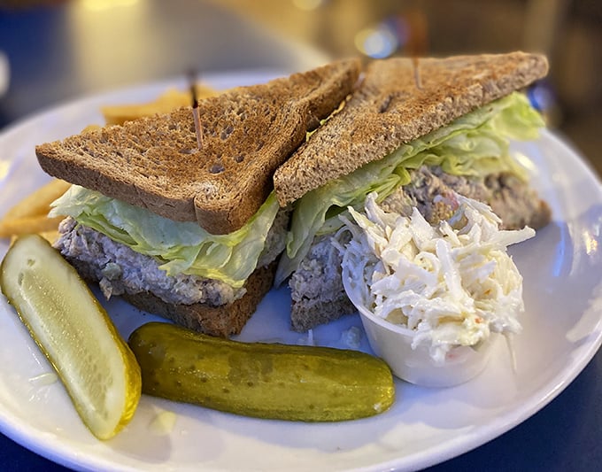 Behold the humble hero—perfectly balanced tuna salad on toasted bread with crisp lettuce and just enough crunch to make your taste buds sing.