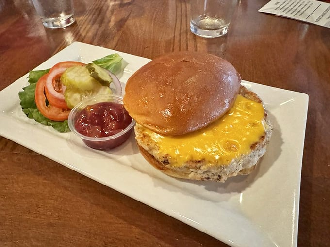 This turkey burger defies all stereotypes—juicy, flavorful, and topped with melted cheese that's doing that perfect slow-motion stretch when you lift the bun.
