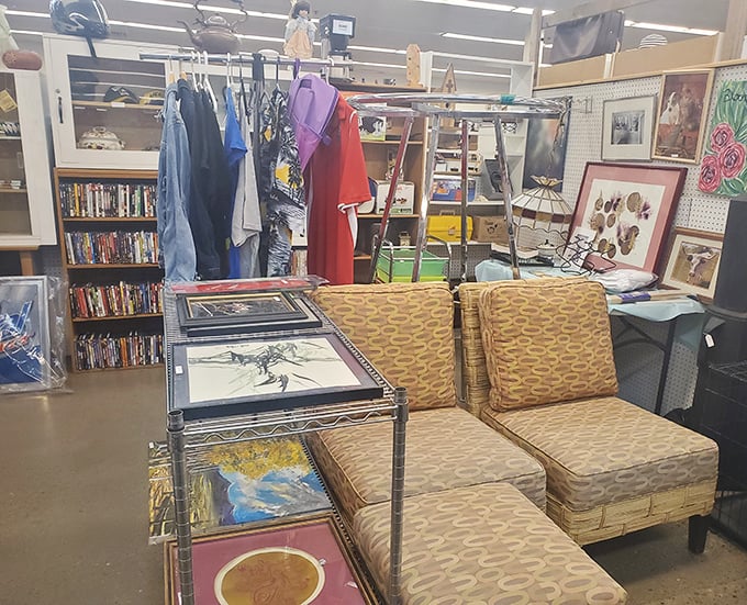 Mid-century furniture meets vintage art in this booth – where your next living room conversation piece is hiding in plain sight.