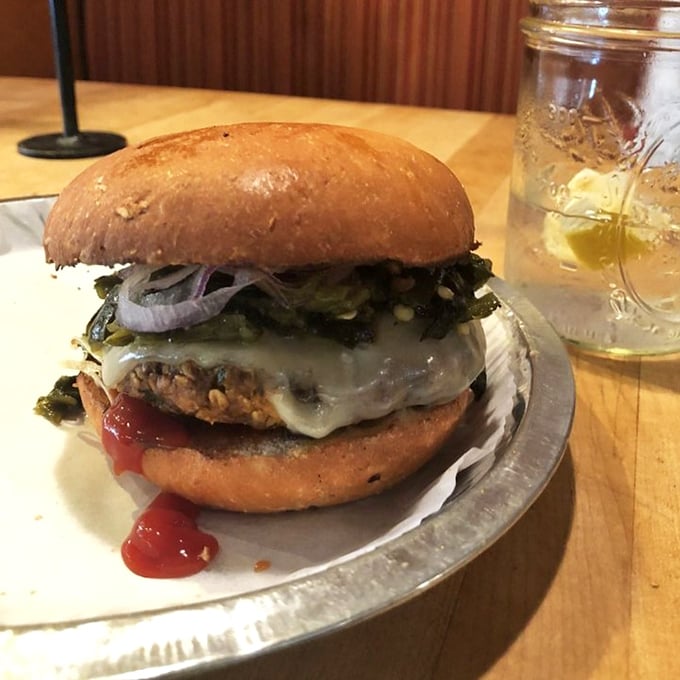 Not just another veggie burger—this handcrafted masterpiece with melted cheese and caramelized onions might just convert the most dedicated carnivore in your life.