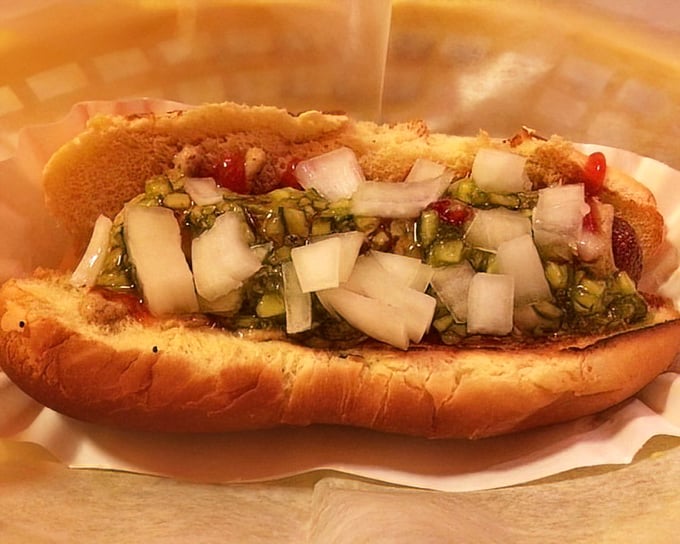 This isn't just a hot dog—it's a carefully orchestrated symphony of toppings, where diced onions and relish dance together on a perfectly toasted bun.