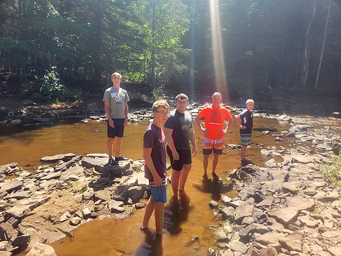 Summer's perfect playground where cool river waters offer sweet relief from hiking trails. Just watch that first step—it's a doozy!