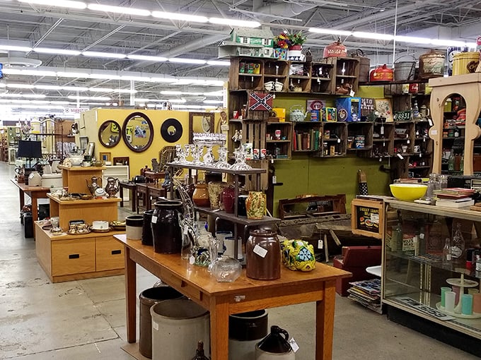 Wooden shelves cradle memories in physical form – from vintage crockery to collectibles that whisper stories of decades past.