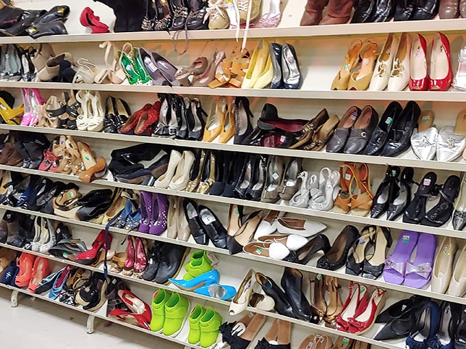 A rainbow of pre-loved heels waiting to dance again – Carrie Bradshaw would need a bigger closet.