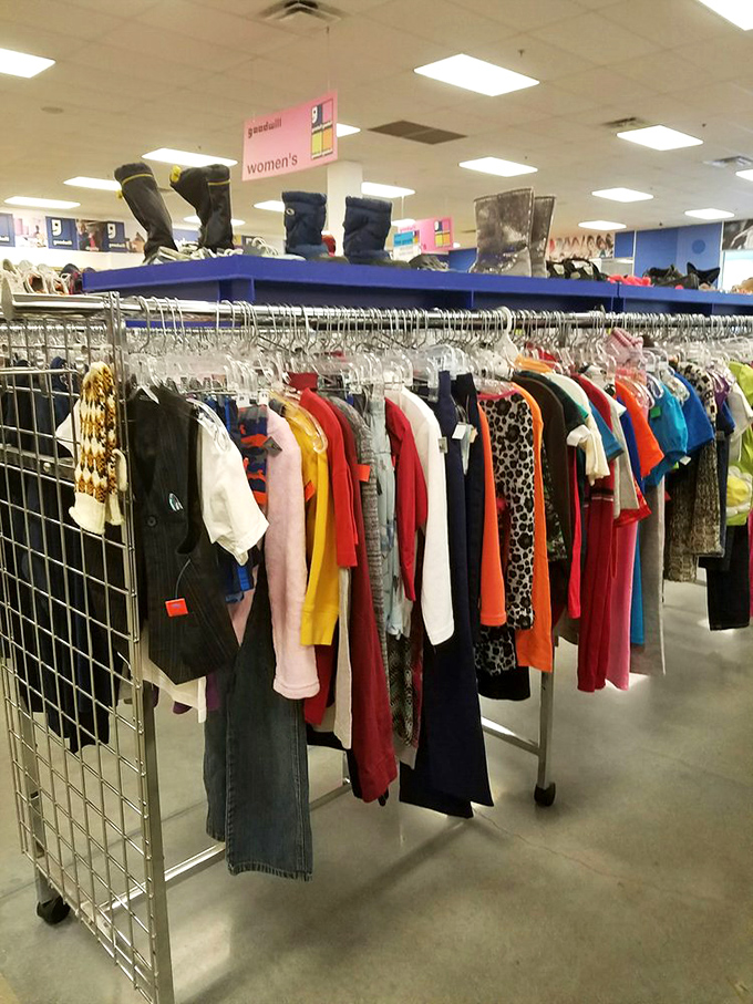The women's section – where yesterday's impulse buys become tomorrow's vintage finds, with winter boots standing guard from above.