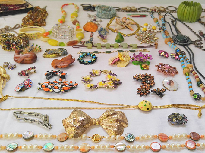 Jewelry that tells stories—from vintage brooches to beaded necklaces. Each piece waiting for its next chapter, like supporting characters in search of their next plot line.