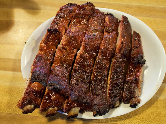 These ribs aren't just falling off the bone – they're practically volunteering to jump onto your plate with that perfect smoke ring. 