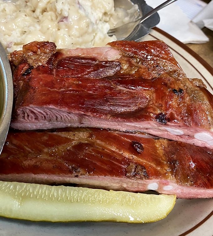 These aren't just ribs; they're edible evidence that patience and smoke create magic. Note that perfect pink smoke ring!