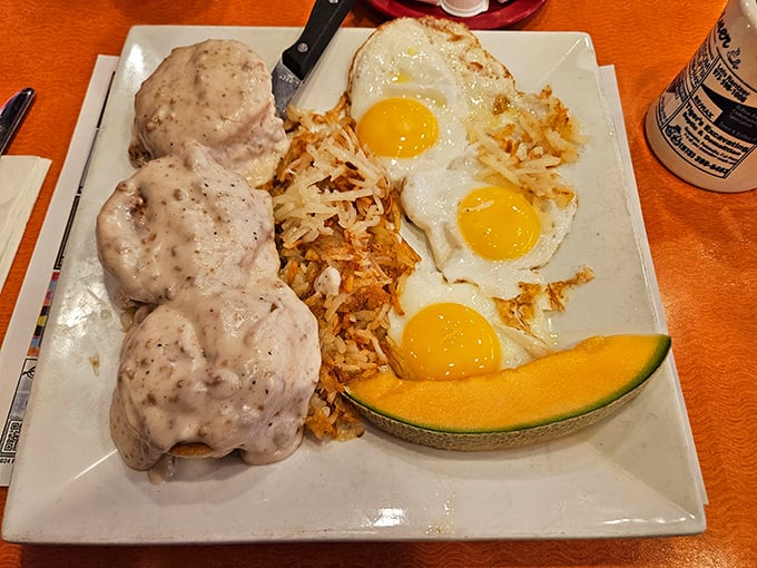 Biscuits and gravy with sunny-side-up eggs and hash browns—the breakfast equivalent of a warm hug from your favorite aunt.