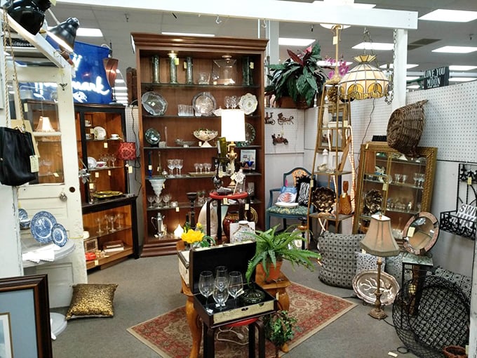 This elegantly arranged booth could be a movie set for "The Crown"—crystal glassware and polished furniture waiting for their second act in someone's home.