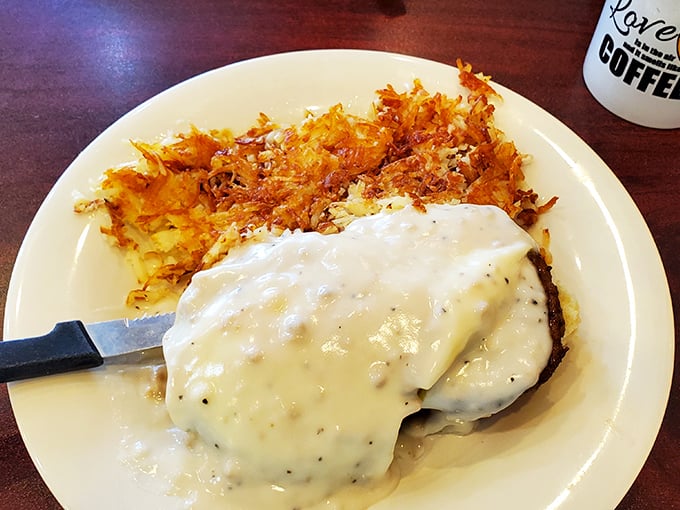 Country fried perfection meets hash brown artistry. This isn't just breakfast—it's what your taste buds would order if they could drive themselves to Florida.