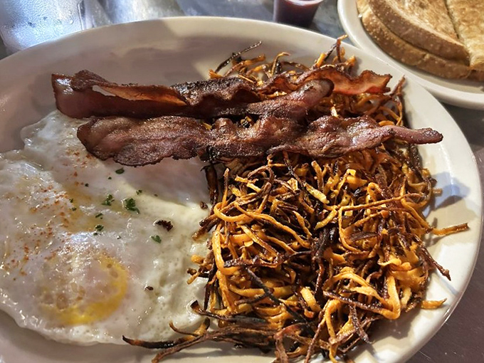 That first bite when perfectly poached eggs meet crispy potatoes – pure morning magic.