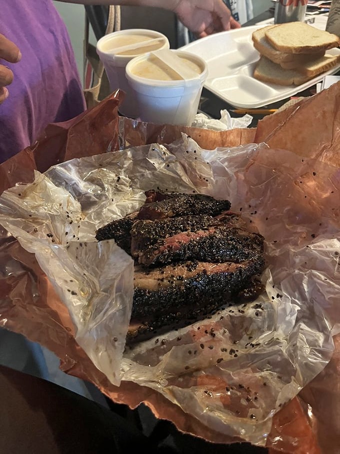Brisket with a bark so perfect it should be in a museum. That pink smoke ring isn't just pretty—it's a diploma from the University of Smoke.