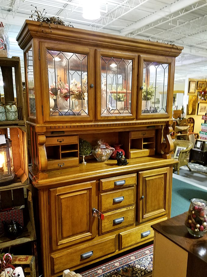 A magnificent oak hutch with leaded glass doors stands as a testament to craftsmanship that's built to last generations, not just warranty periods.