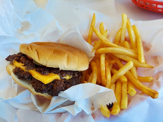 This isn't just a cheeseburger—it's edible poetry with a side of golden fries that would make any fast-food chain weep with envy.