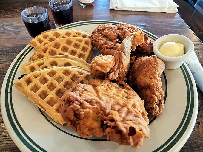 Golden waffles meet perfectly fried chicken in a dance of sweet and savory. This isn't just breakfast—it's edible joy on a plate.