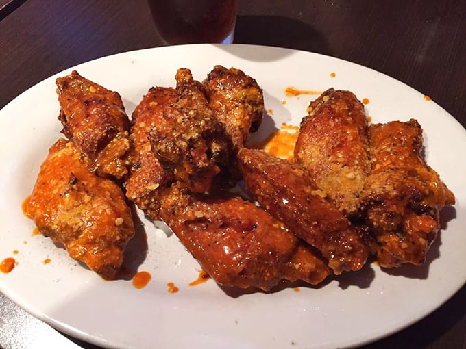 These wings aren't playing second fiddle to pizza—they're conducting their own spicy symphony of flavors that demands attention.