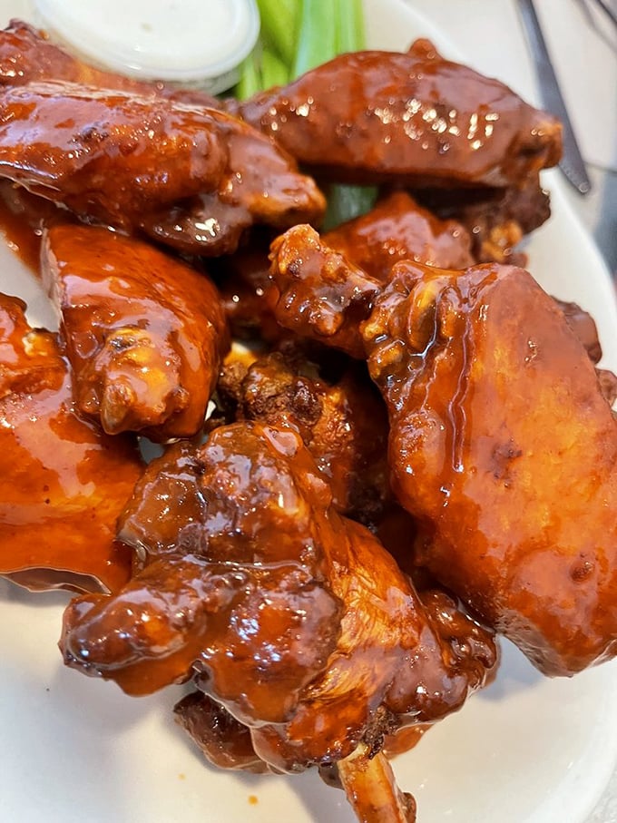 These wings aren't just sauced—they're dressed for the most delicious prom ever. Glistening with flavor that makes napkins necessary and regrets impossible.