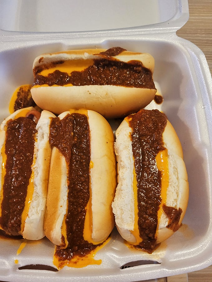 Meet the star attraction: chili cheese dogs that inspire poetry. The perfect snap of the frank, the warm embrace of homestyle chili, the gooey cheese—it's edible harmony.