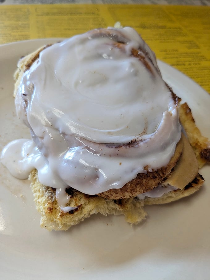 The star of the show – a cinnamon roll that doesn't just satisfy hunger but creates memories. That frosting river would make the Mississippi jealous.