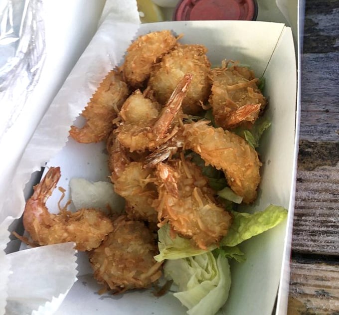 Golden treasures from the Gulf. These coconut shrimp aren't just fried—they're transformed into crispy, sweet morsels that might make you forget your table manners.