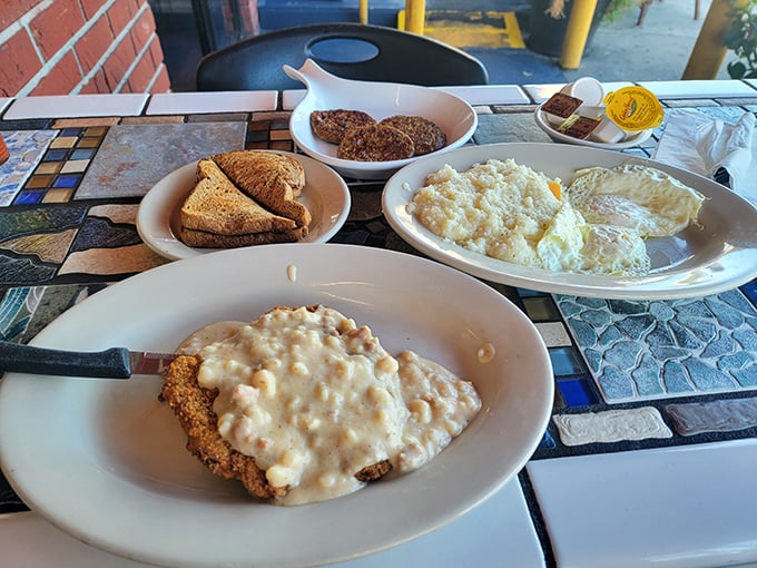 Country fried steak swimming in creamy gravy isn't diet food—it's soul food. The kind that makes you forget calorie counts exist.