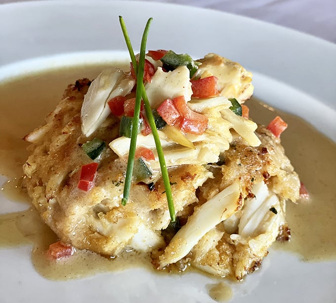 This isn't just a crab cake; it's crab architecture—delicately stacked, perfectly seasoned, and worthy of its own HGTV special.