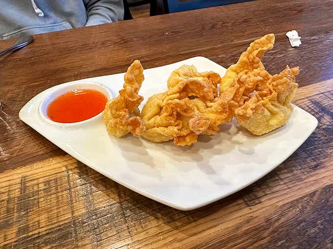 Crab rangoon that shatters with a satisfying crunch, revealing a creamy interior that makes you wonder why you'd ever waste stomach space on mozzarella sticks.