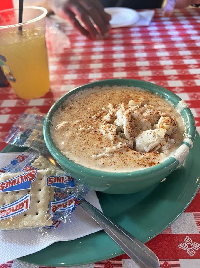 Cream of crab soup that's practically a religious experience. That sprinkle of Old Bay on top is like the seafood equivalent of fairy dust.