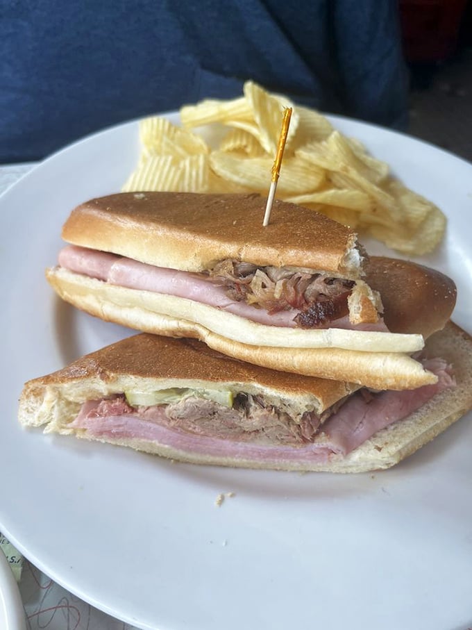 This Cuban sandwich isn't just lunch – it's Miami history pressed between bread, where roasted pork and ham conduct a delicious diplomatic summit.