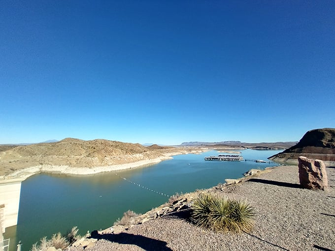 Engineering marvel meets natural splendor. The dam that created this desert paradise stands as proudly as a contestant on The Great British Bake Off.