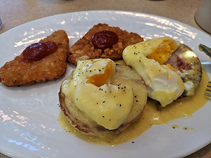 These eggs Benedict aren't just breakfast—they're a masterclass in morning perfection, with golden hollandaise cascading over perfectly poached eggs like sunrise over Pennsylvania hills.