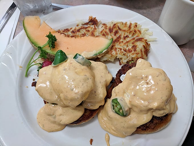 Eggs Benedict elevated to an art form—poached eggs nestled on English muffins, blanketed in hollandaise that's somehow both rich and light.
