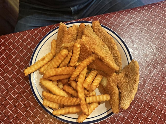 Golden-battered perch fillets and crinkle-cut fries—a plate that doesn't need fancy plating when it tastes like the best day at the lake.