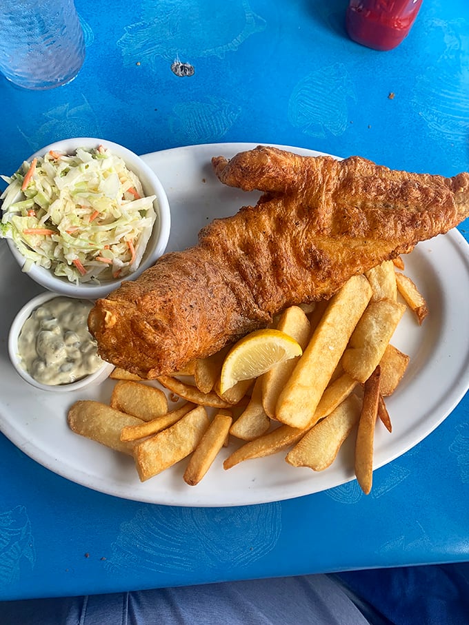 Fish and chips that would make a British pub jealous—golden-battered perfection with coleslaw that didn't come from a bucket.