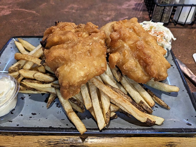 Golden-battered cod resting on a bed of hand-cut chips—this isn't just fish and chips, it's edible poetry that would make Dublin proud.