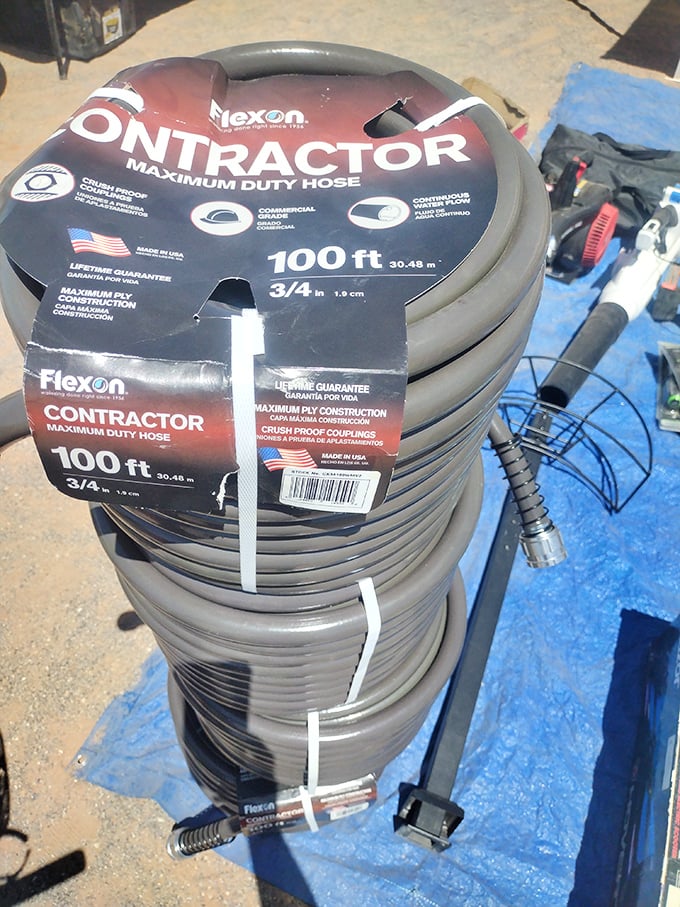 Even practical purchases become treasure hunt victories—these contractor-grade garden hoses waiting for their forever homes.