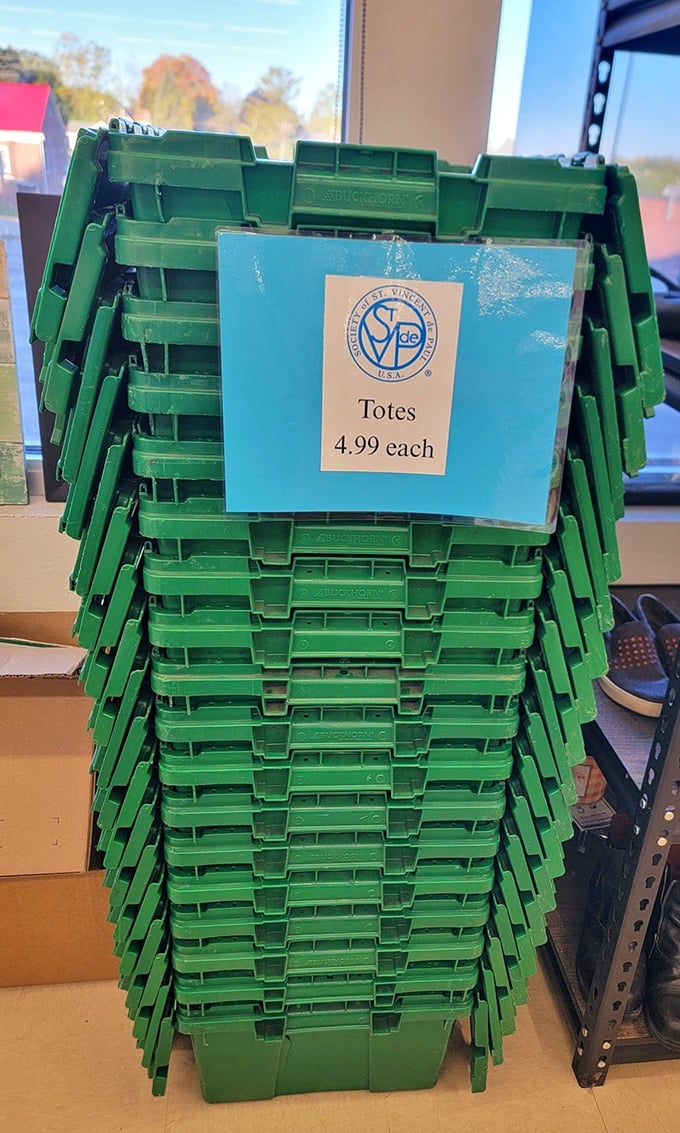 Thrift store organization at its finest. These stackable green totes await shoppers ready to haul home their treasures for less than a fancy latte.