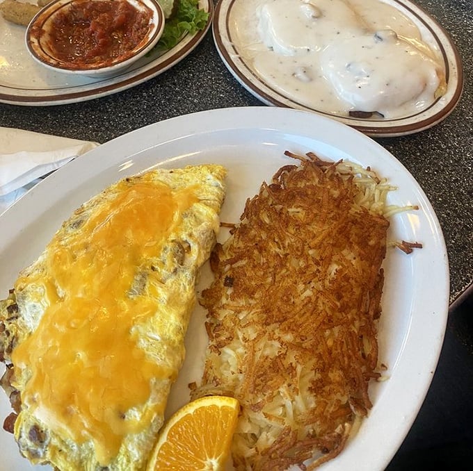 This golden omelet and crispy hash browns combo isn't just breakfast – it's edible sunshine that might actually be worth getting out of bed for.