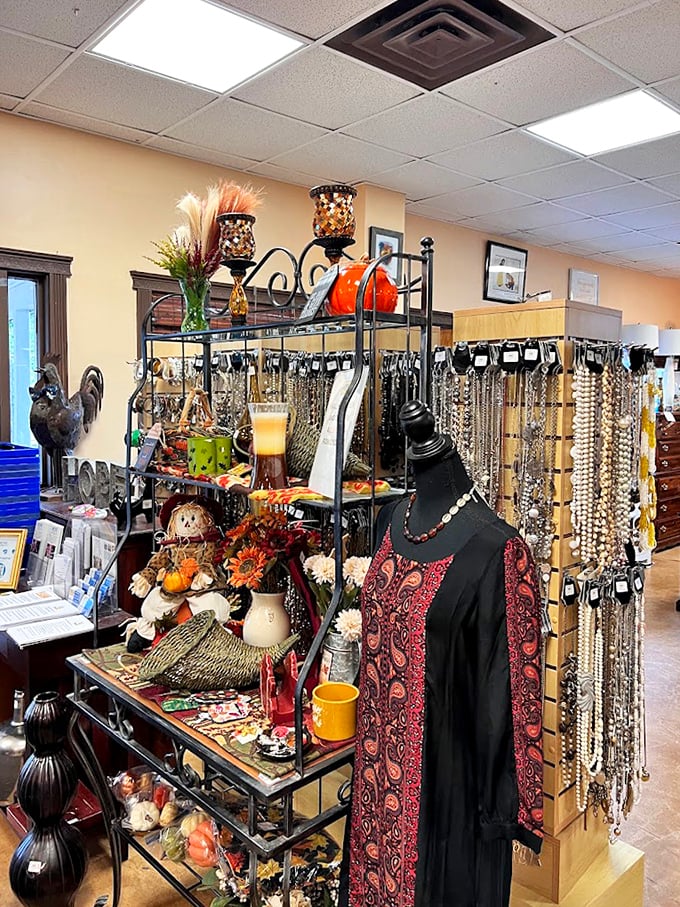 Seasonal decor meets fashion forward—this mannequin's paisley ensemble and surrounding treasures prove that "thrifted" and "curated" aren't mutually exclusive concepts.