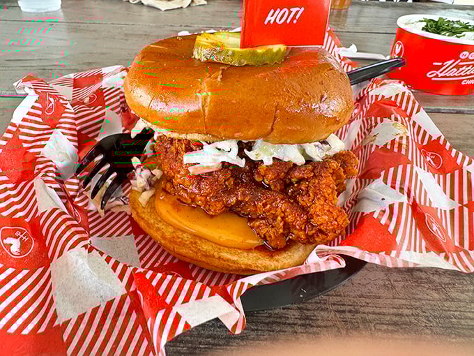 This sandwich isn't just food; it's architecture—a towering masterpiece of crispy chicken, cooling slaw, and pickles that deserves its own ZIP code.
