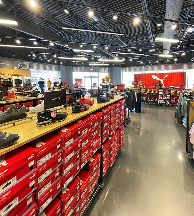 Rows of bright red shoe boxes stacked like treasure chests, each containing the potential for your next favorite pair.