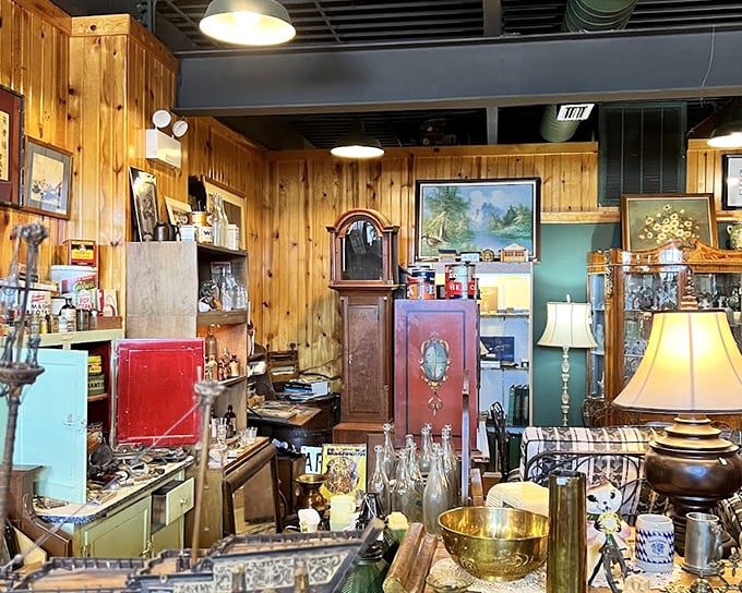 Wood-paneled walls create the perfect backdrop for this carefully curated chaos—where that grandfather clock has likely witnessed more history than most history books.