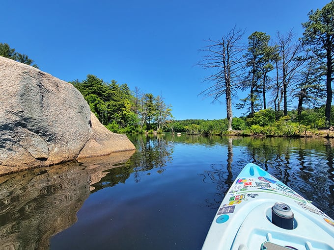 Paddling perspective: From a kayak, those massive shoreline boulders transform from obstacles to natural sculptures worthy of their own museum exhibit.