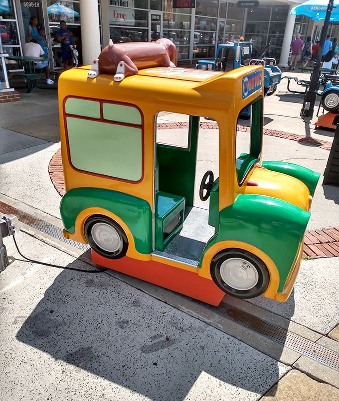 Even the little ones get a shopping break! This cheerful kiddie ride offers a moment of joy between stores—because future bargain hunters need training too.