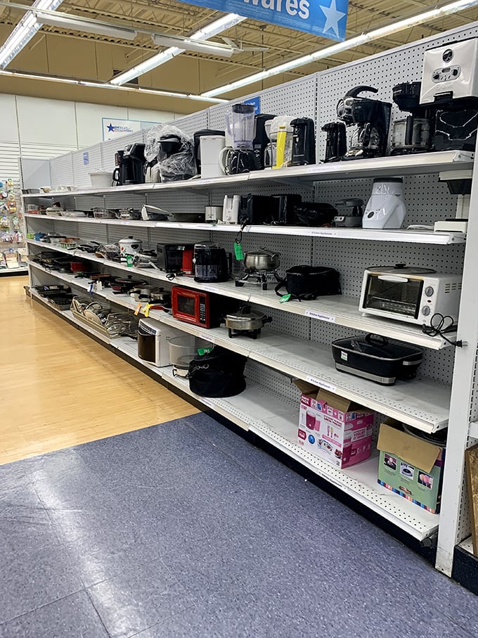 Kitchen appliance heaven or small appliance purgatory? One shopper's cast-off coffee maker becomes another's morning salvation, all neatly arranged on pegboard shelves.