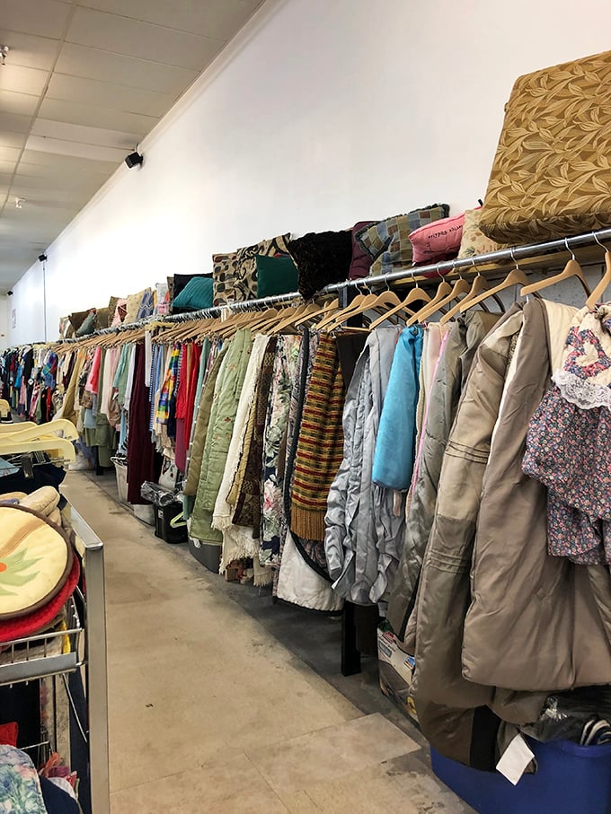 Coats, jackets, and linens lined up like soldiers ready for inspection—each with a story and a second chance at making someone's wardrobe complete.