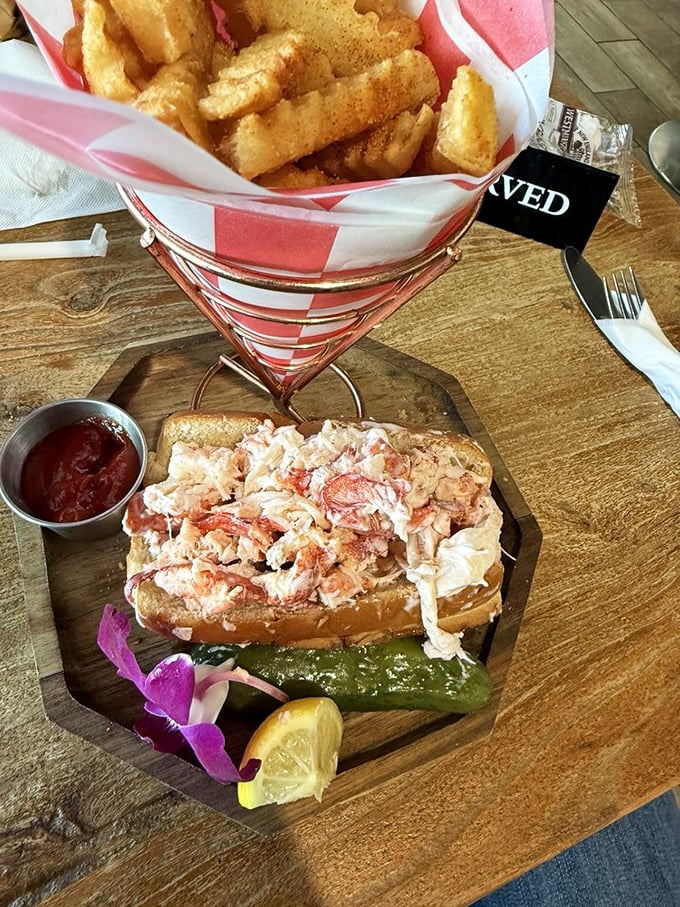 The star of the show: chunks of sweet lobster meat barely contained by a perfectly toasted roll. This isn't a sandwich; it's a religious experience.